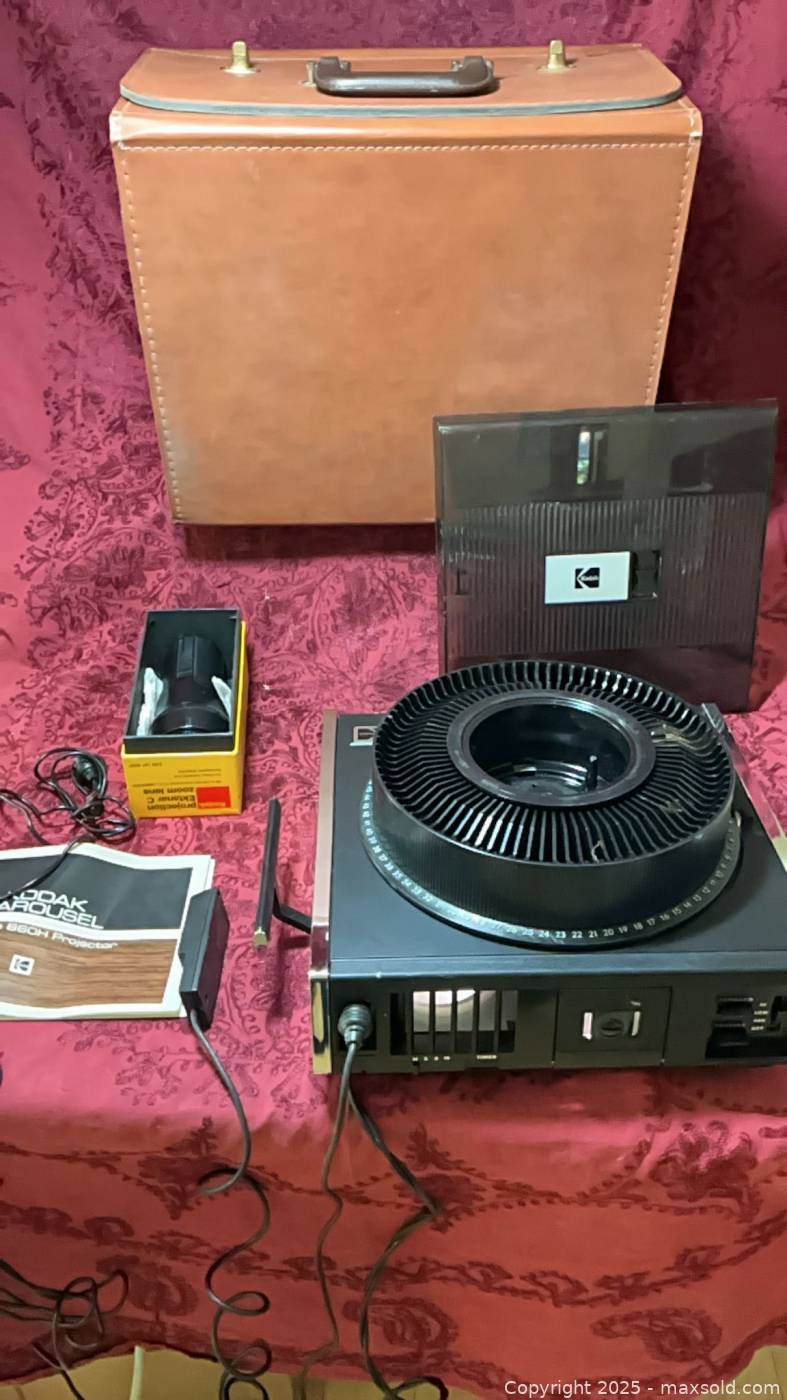 Kodak slide projector with case, lens, remotes, carousel | Maxsold