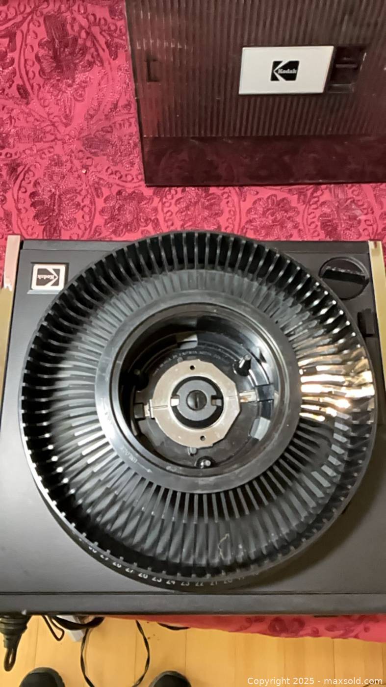 Kodak slide projector with case, lens, remotes, carousel | Maxsold