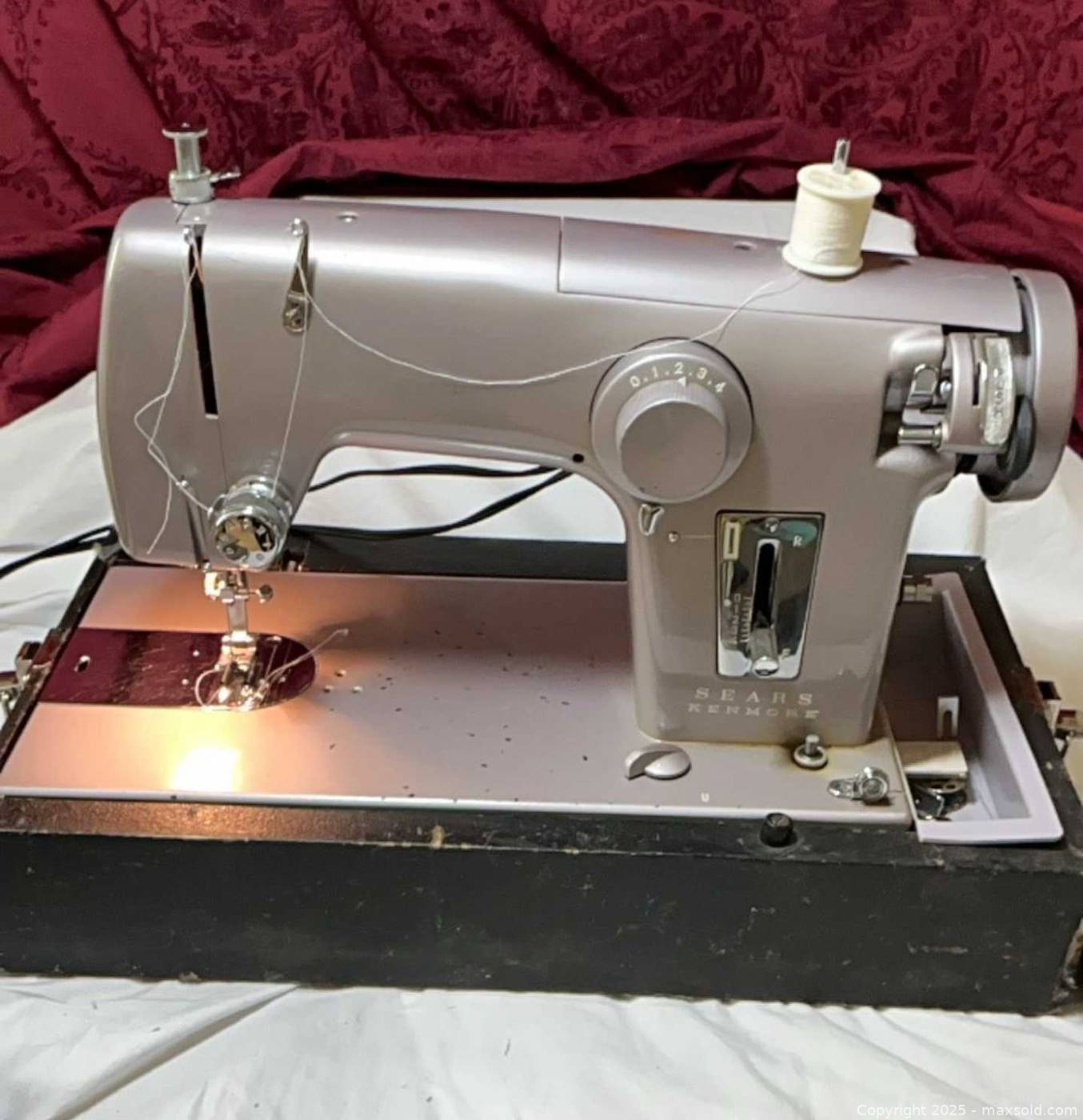 Kenmore model 117.552 sewing machine with accessories | Maxsold