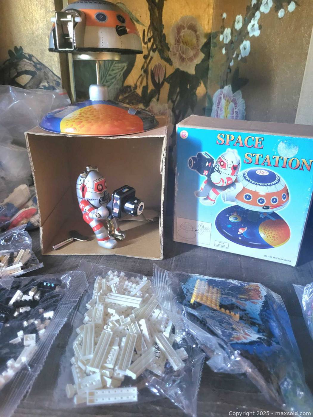 Lego bricks, Space Station toy, Homer Simpson Pez, Roxx discs | Maxsold