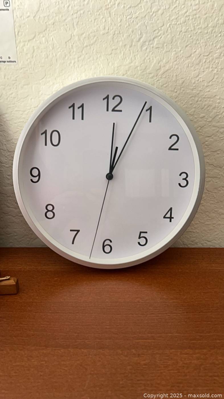 Two wall clocks and crucifix | Maxsold