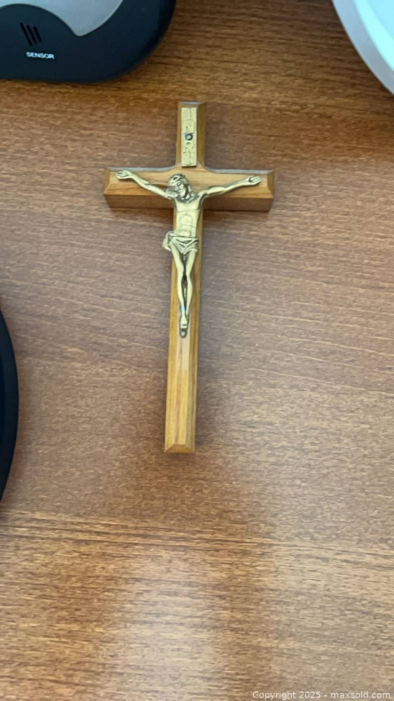 Two wall clocks and crucifix | Maxsold