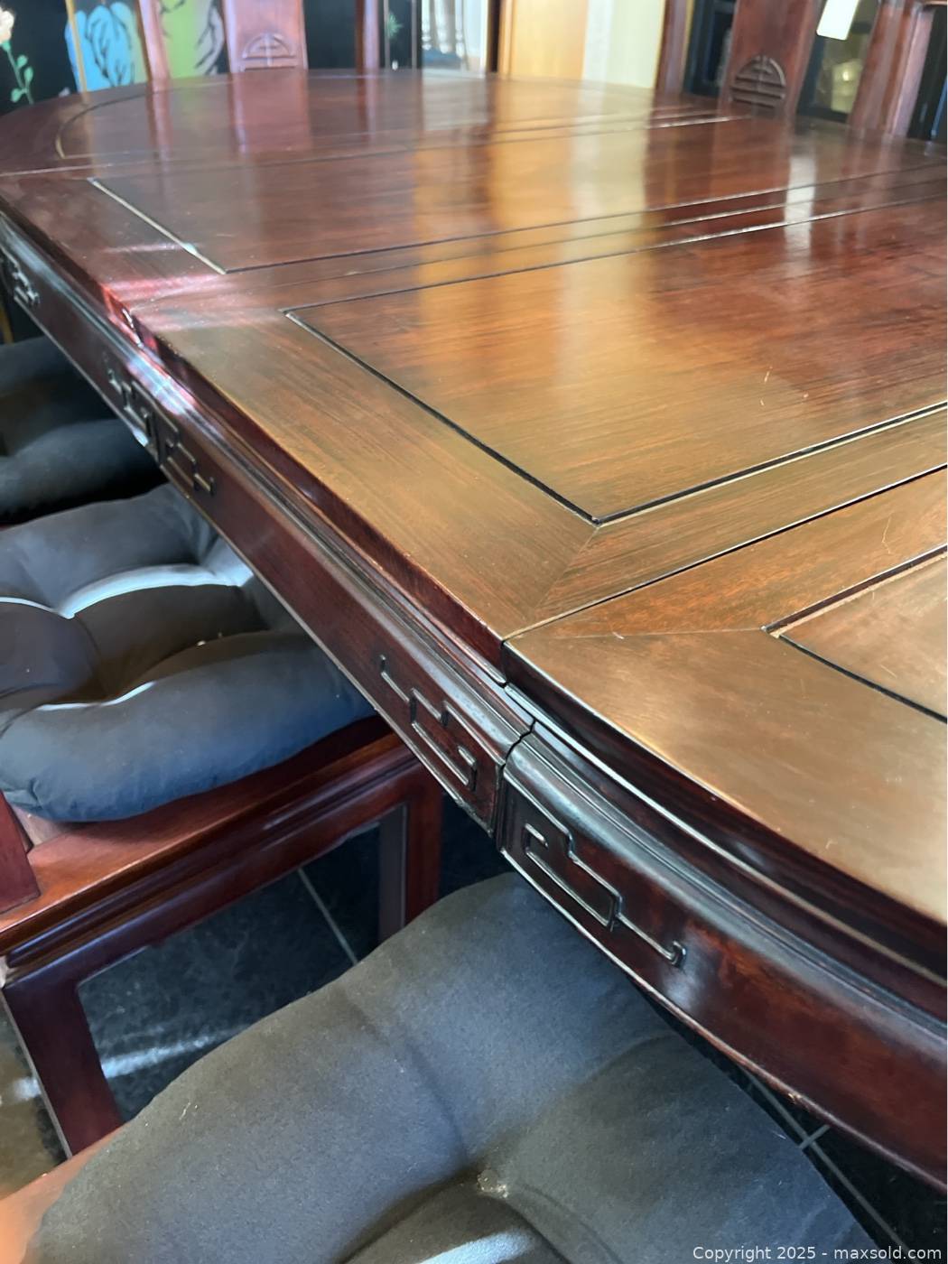 Asian style wood dining table with 2 leaves and 8 side chairs | Maxsold
