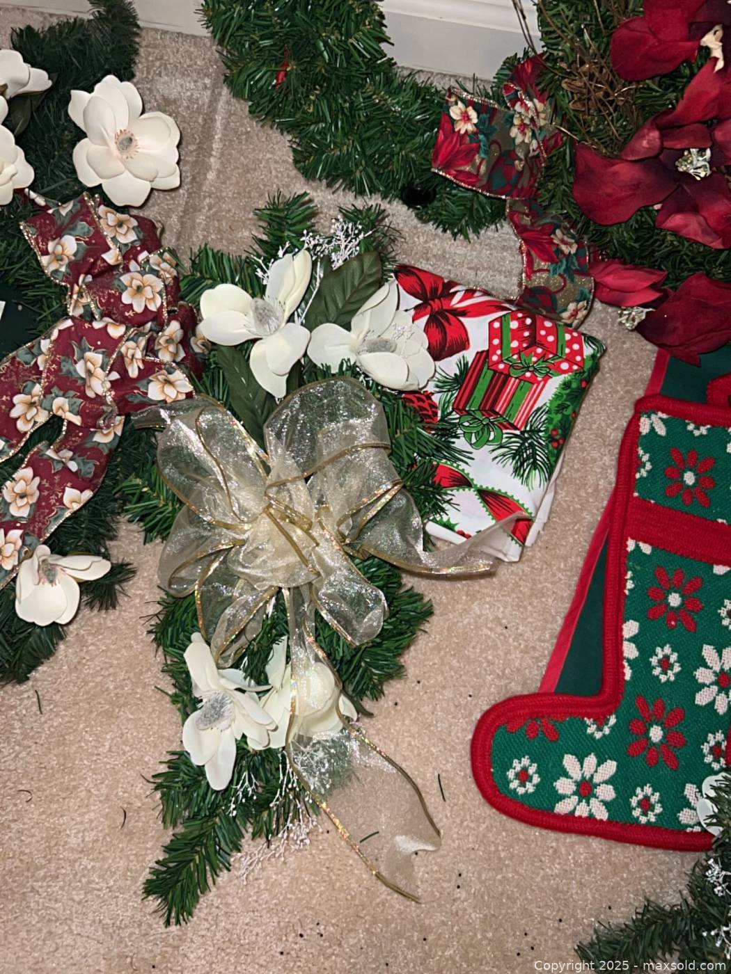 Christmas wreaths, centerpiece, stocking, banner | Maxsold