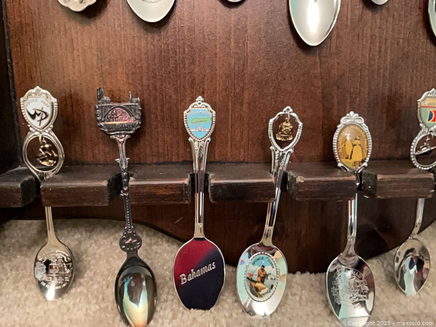 Souvenir collector spoons and wooden wall rack | Maxsold