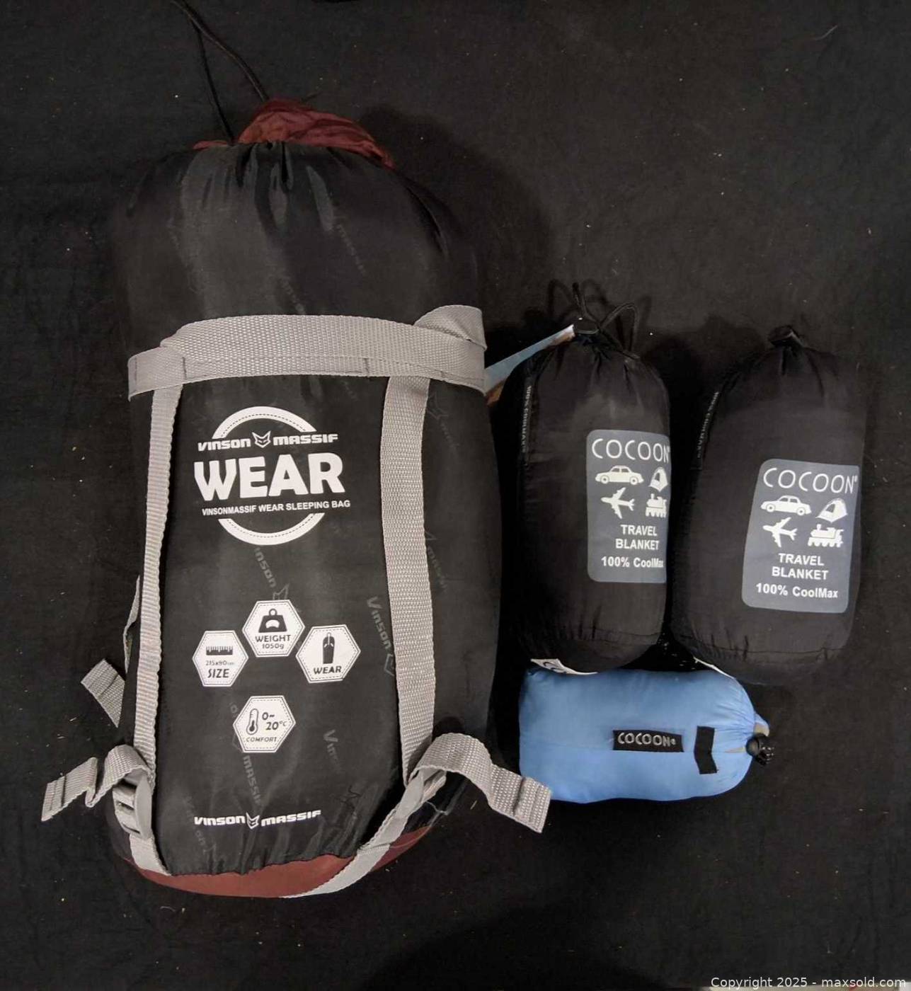 Camping assortment with sleeping bag, travel blankets, flashlights ...