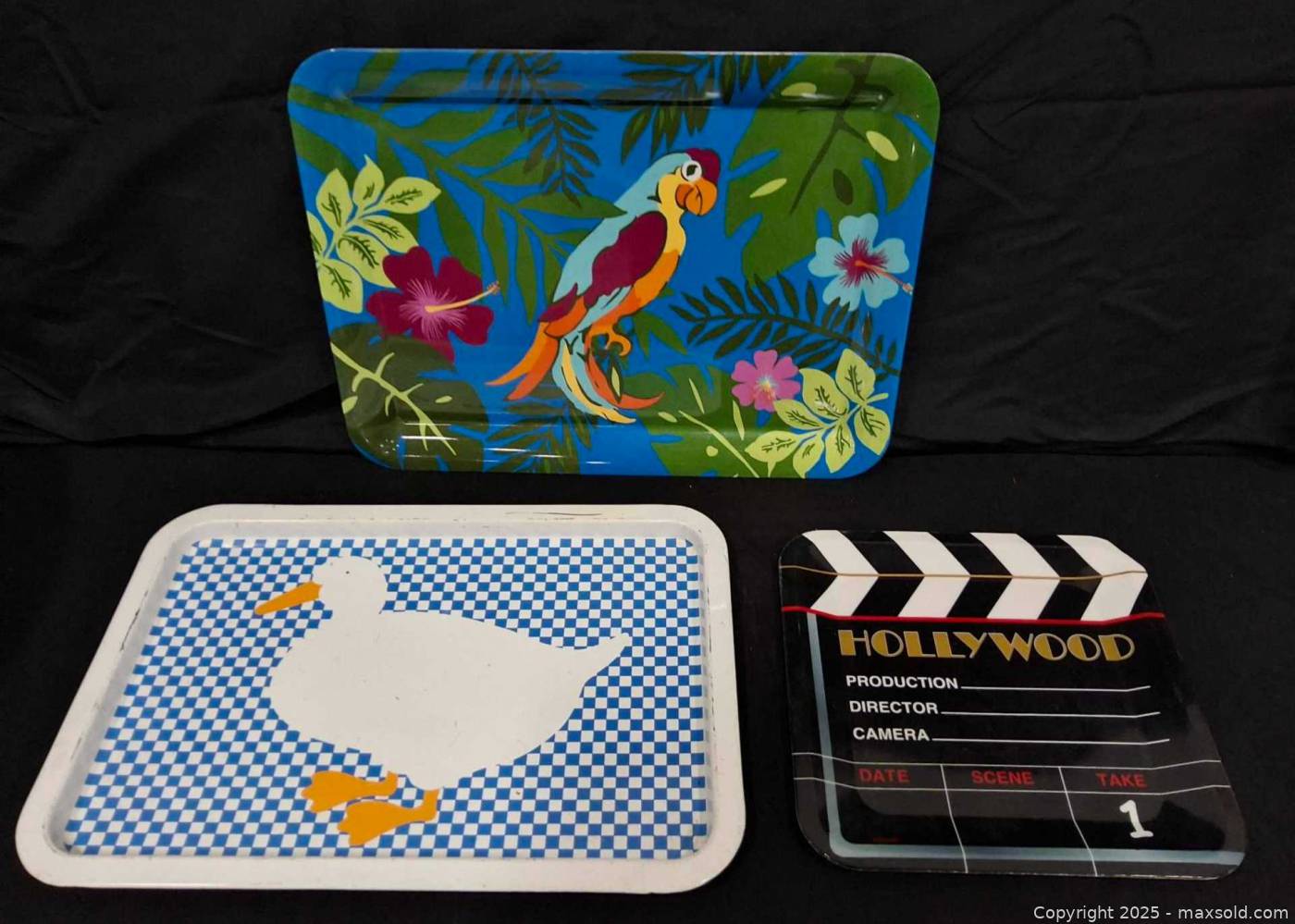 Three decorative metal serving trays | Maxsold