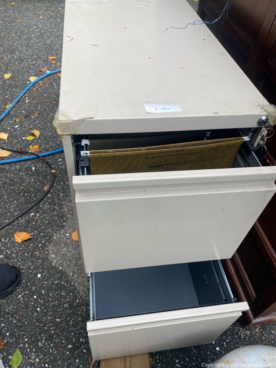 Small two-drawer filing cabinet with keys | Maxsold