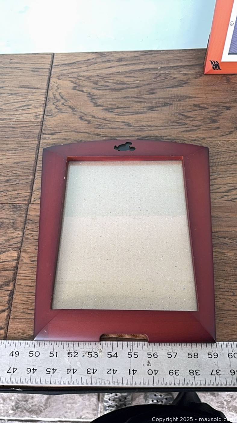 Disney photo frames and brochure | Maxsold