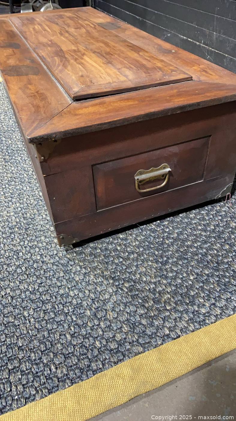 Antique wooden chest on castors & carpet | Maxsold
