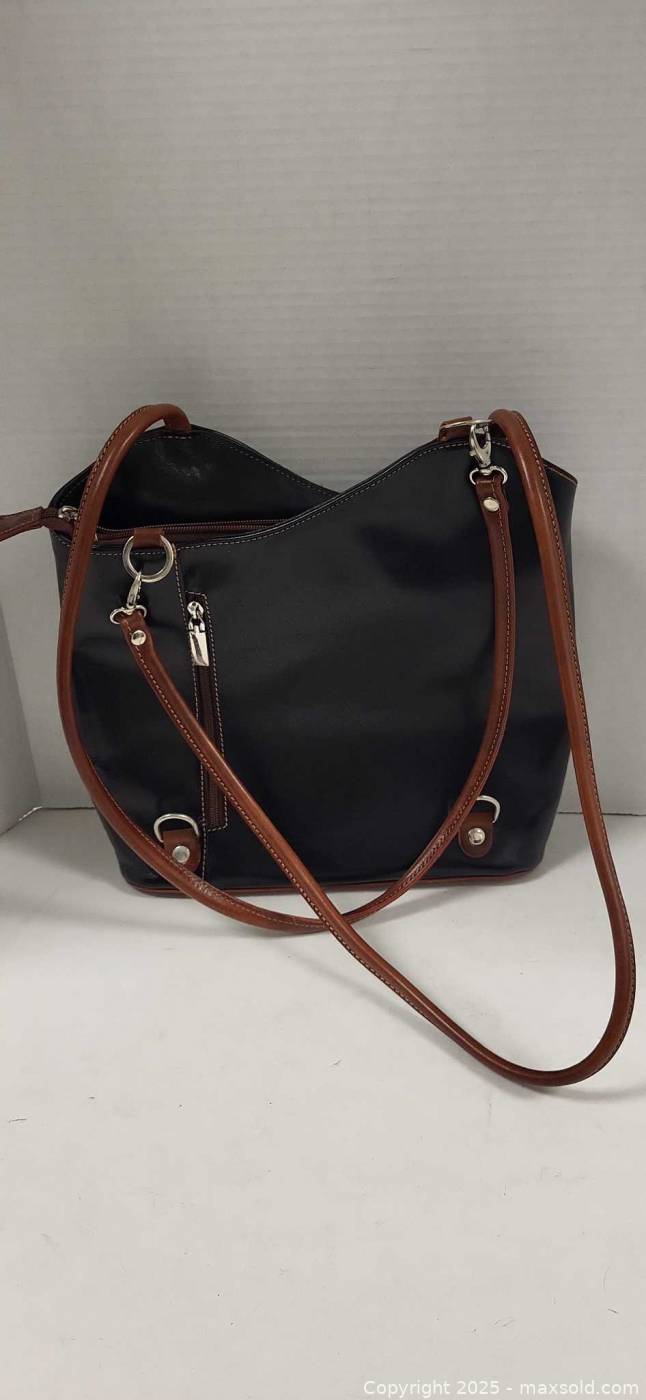 Three black leather purses | Maxsold