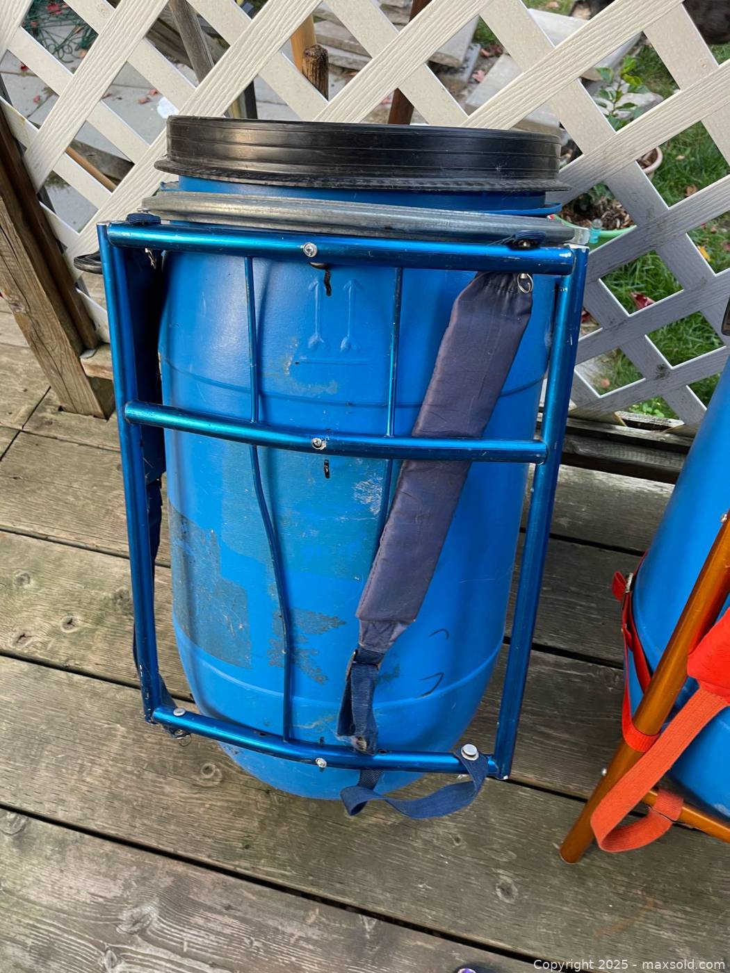 Two blue food storage barrels with frames | Maxsold