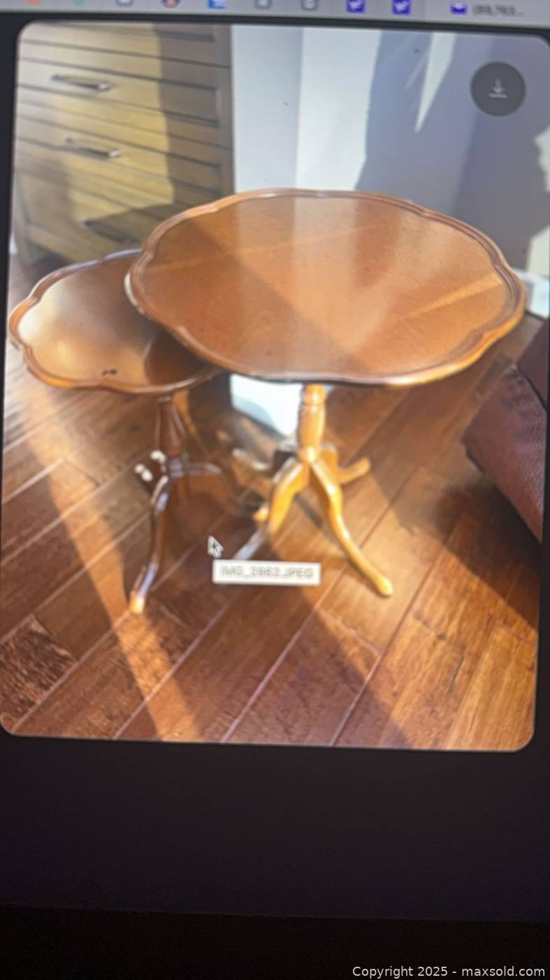 Pair solid wood pedestal nesting tables | Maxsold