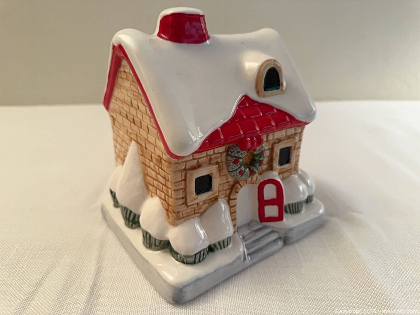Two ceramic Christmas music box houses | Maxsold