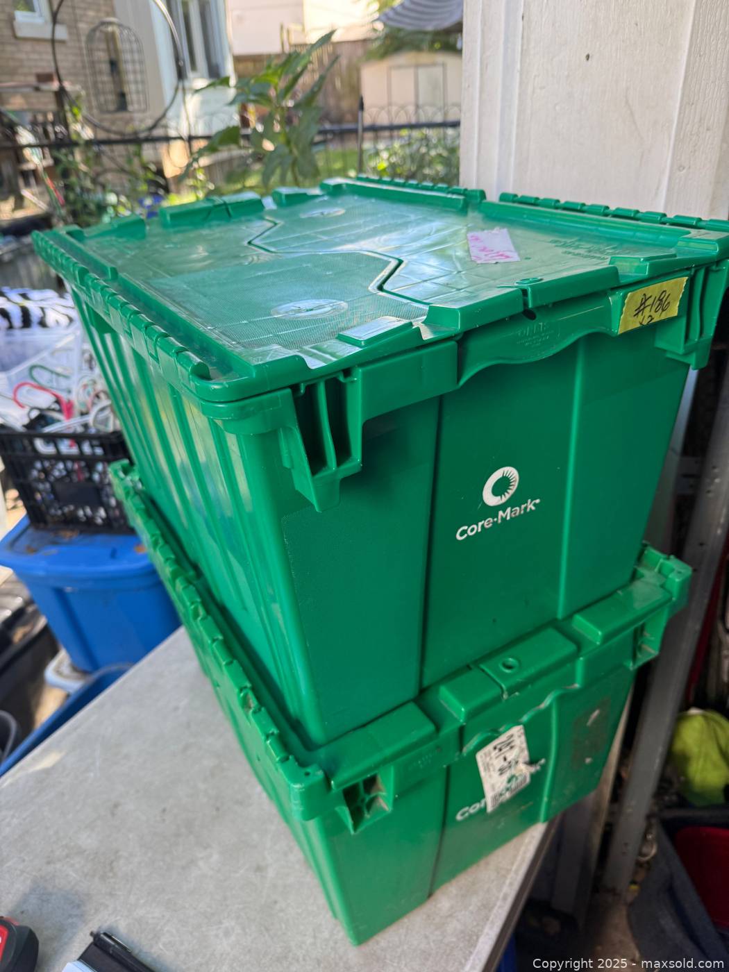 2 green Core-Mark plastic totes with folding lids | Maxsold