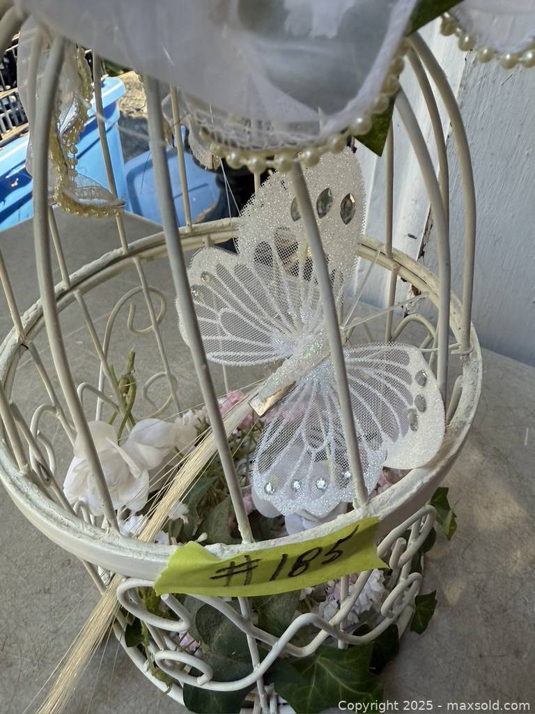 white metal decorative cage with faux butterfly | Maxsold