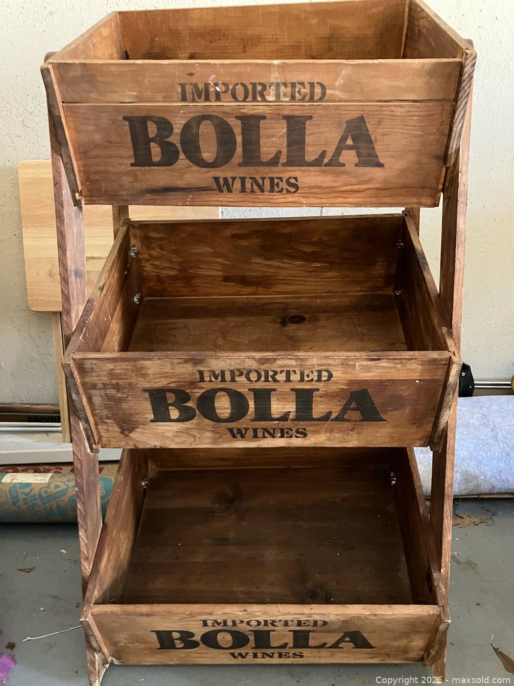 Bolla Imported Wines three-tier wooden display shelf | Maxsold