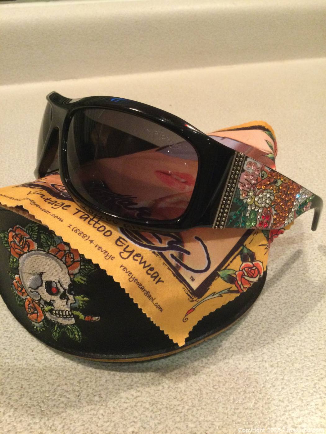 Ed Hardy sunglasses, leather case, lens cloth | Maxsold