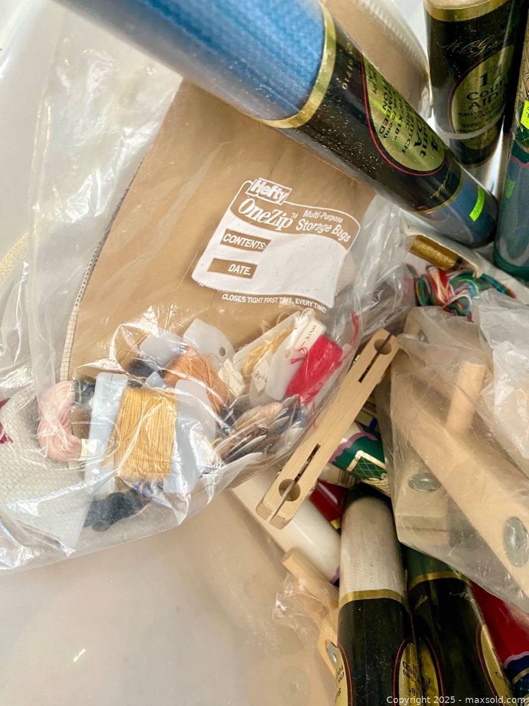 Cross stitch fabric rolls, stretcher bars & thread | Maxsold