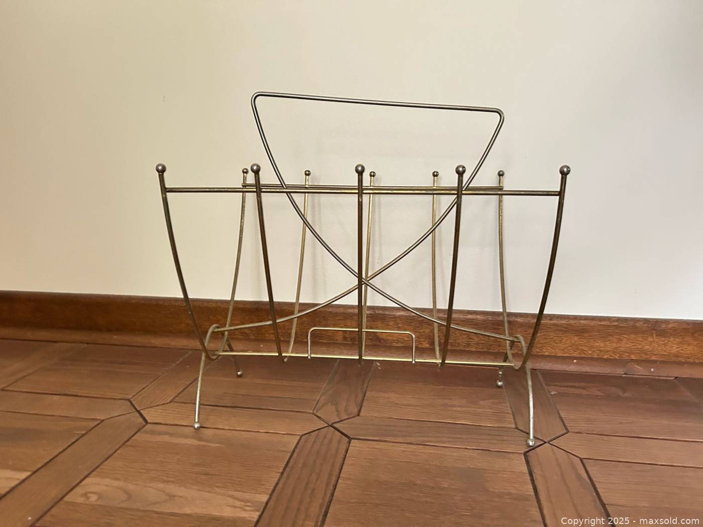 Mid-century brass wire magazine rack | Maxsold