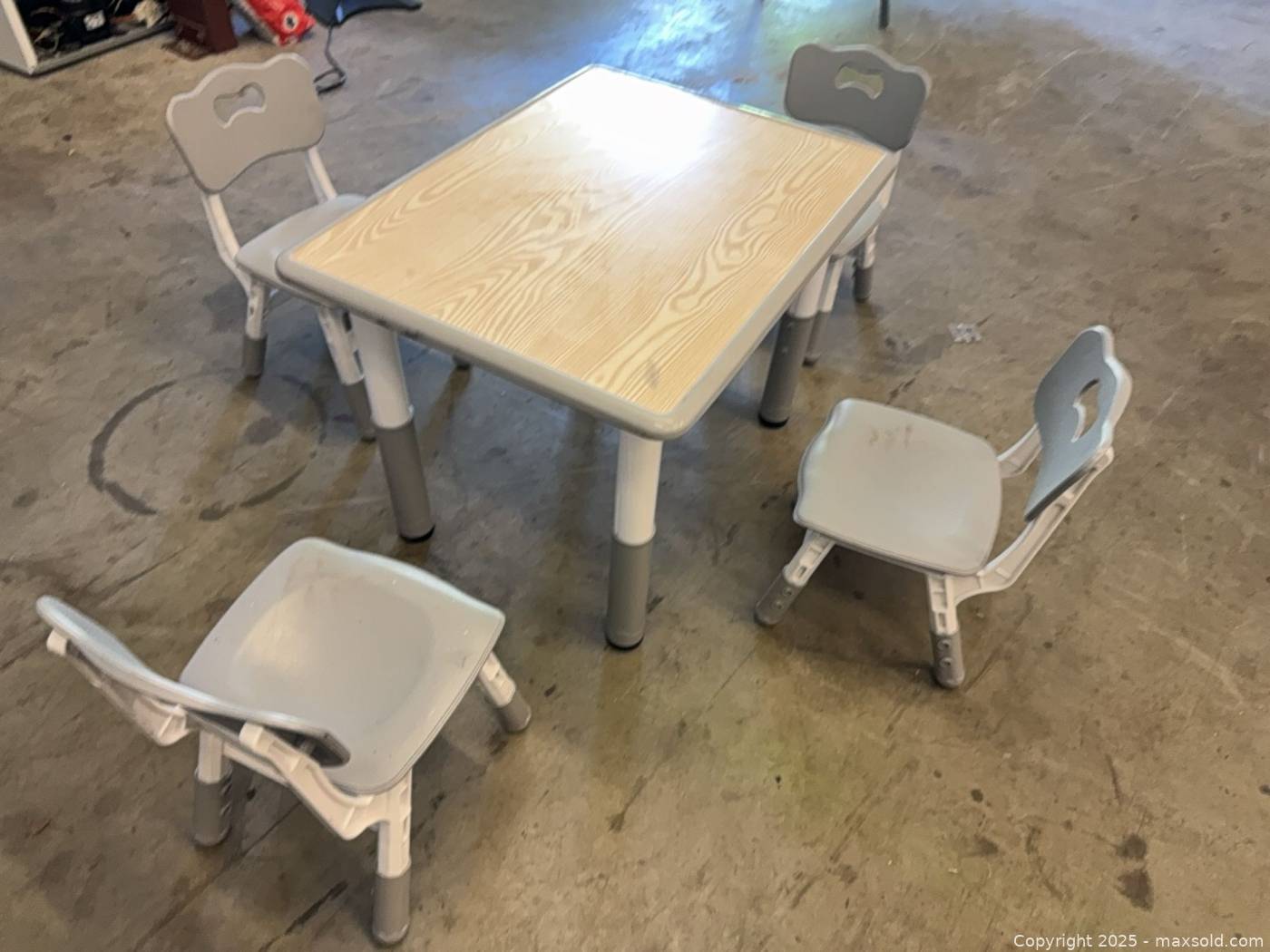 Kids activity table and 4 chairs | Maxsold