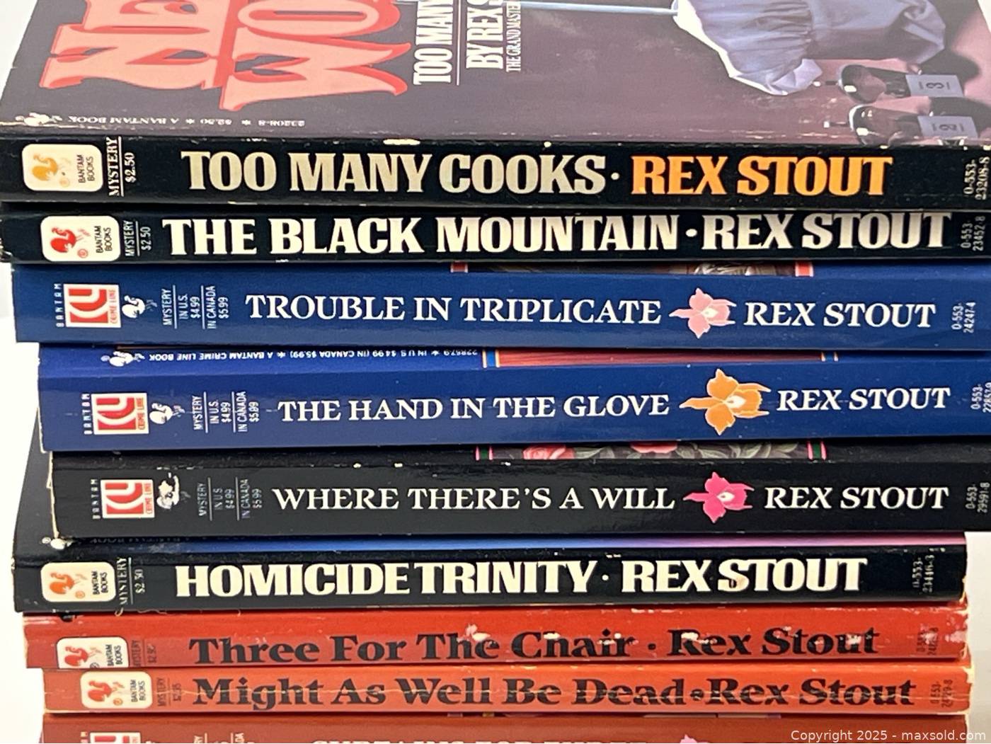 54 Rex Stout “Nero Wolfe” paperbacks | Maxsold