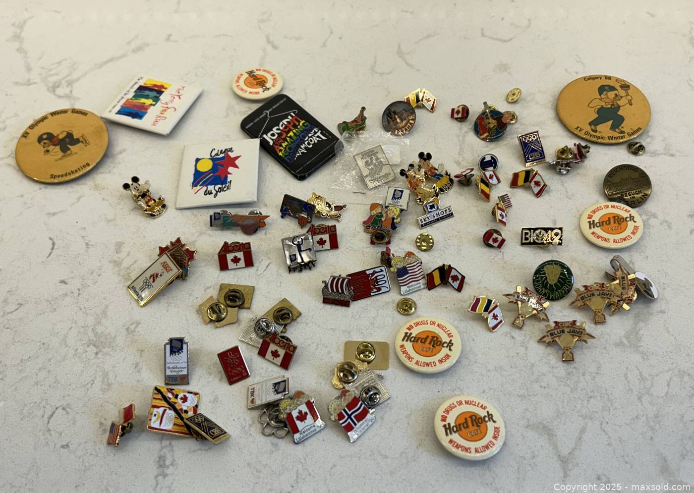 Mixed Olympic, Disney, Hard Rock and flag pins | Maxsold