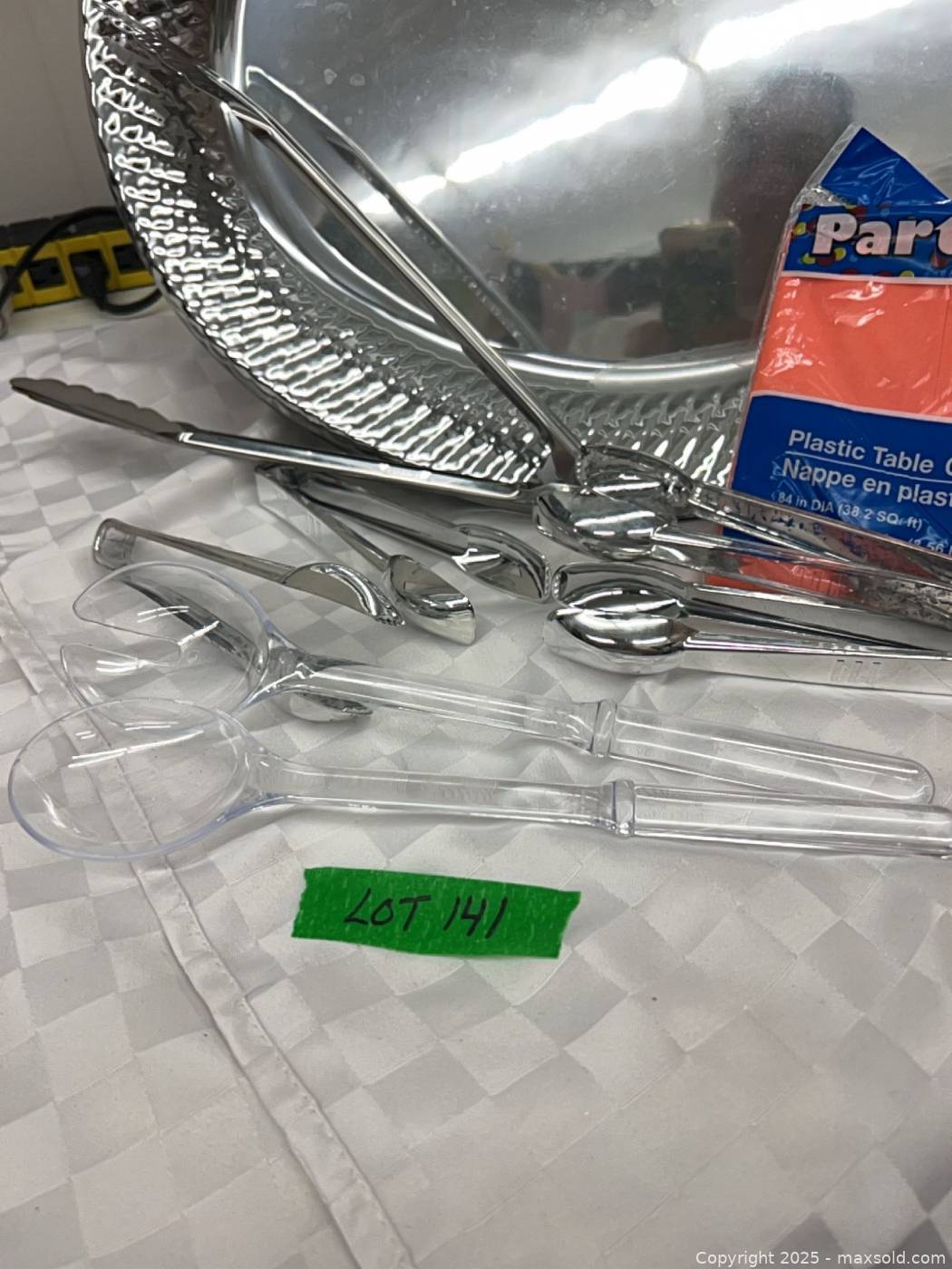 Oval serving tray, tongs, plastic utensils, round table cover | Maxsold