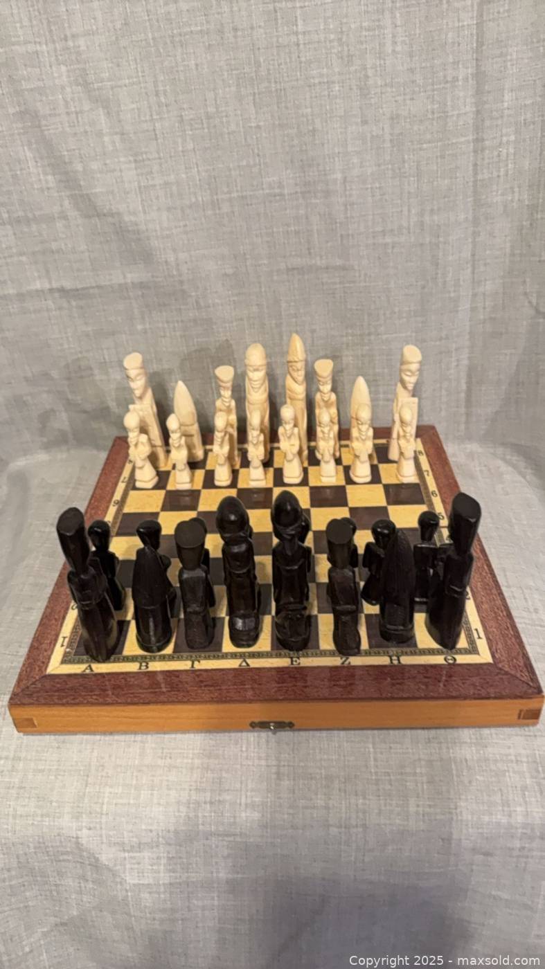 Hand-carved wood & bone chess set with folding 12 in board | Maxsold