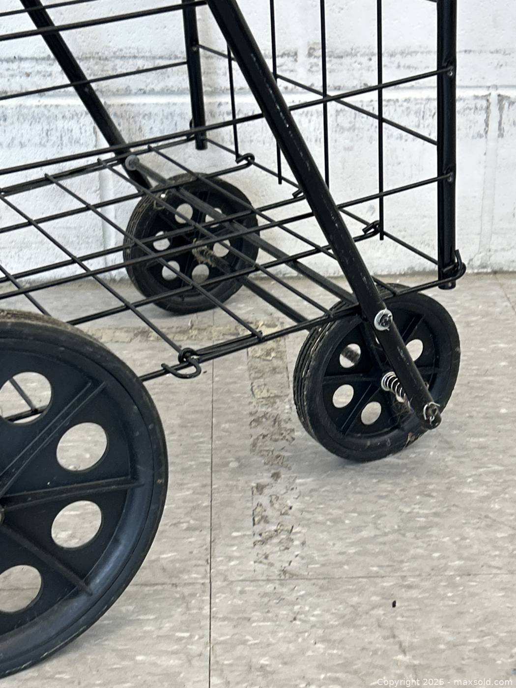 Black folding wire shopping cart | Maxsold