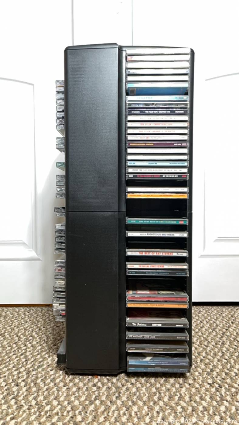 Swivel CD tower holder with approx. 50 CDs | Maxsold