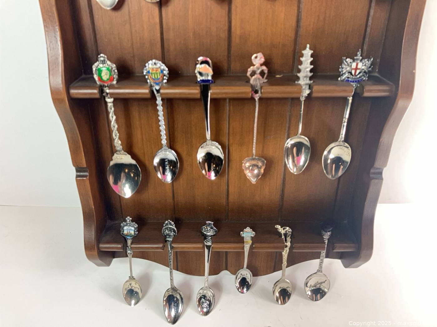 Collectible souvenir spoons with display rack | Maxsold
