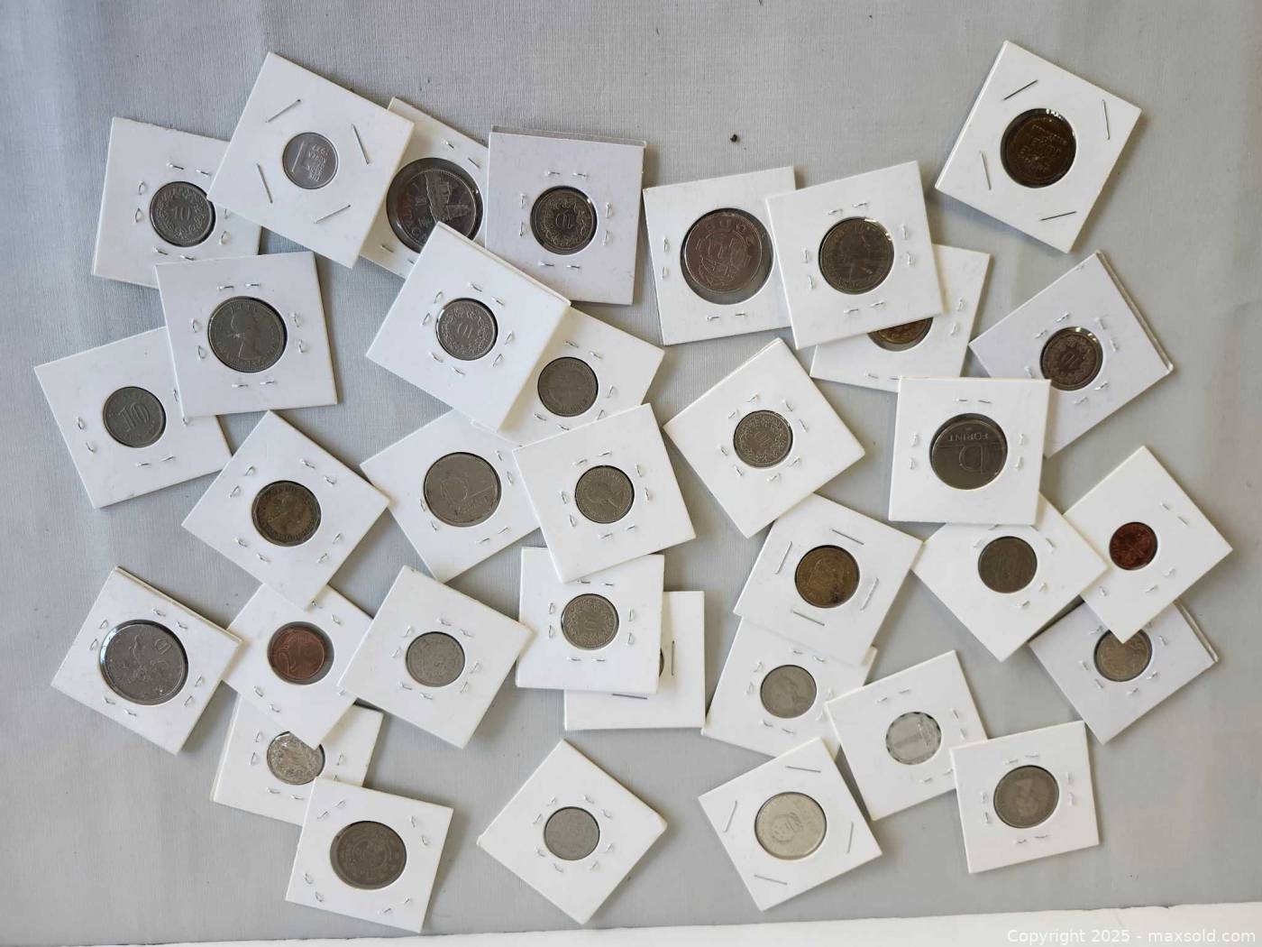 Mixed foreign coins, 30+ pieces | Maxsold
