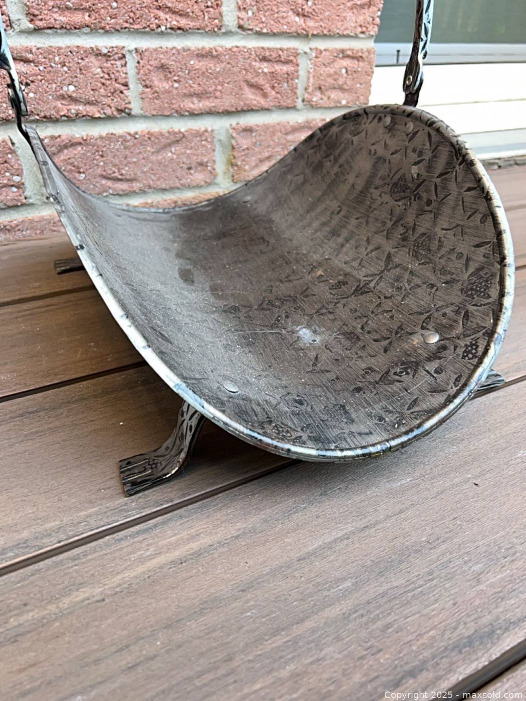 Cast iron hand-crank tray and metal log cradle | Maxsold