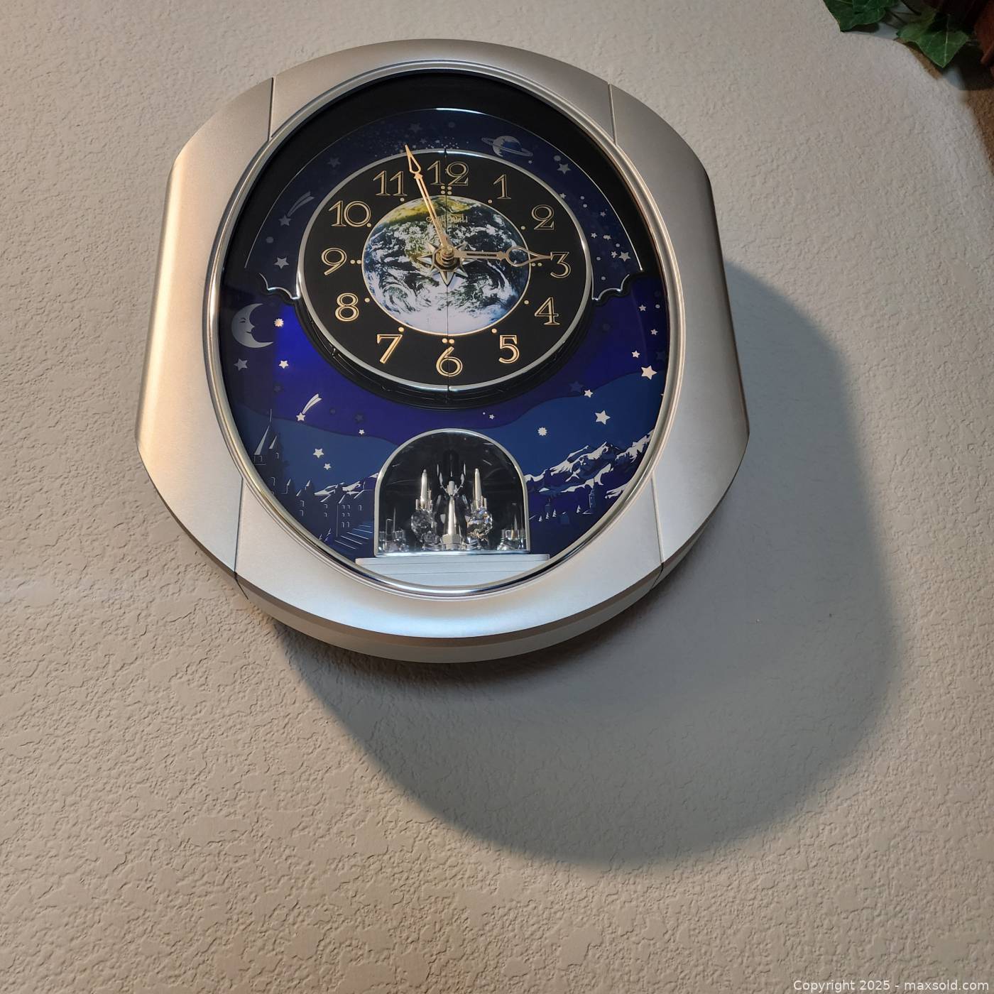Rhythm "Peaceful Cosmos II" musical wall clock | Maxsold