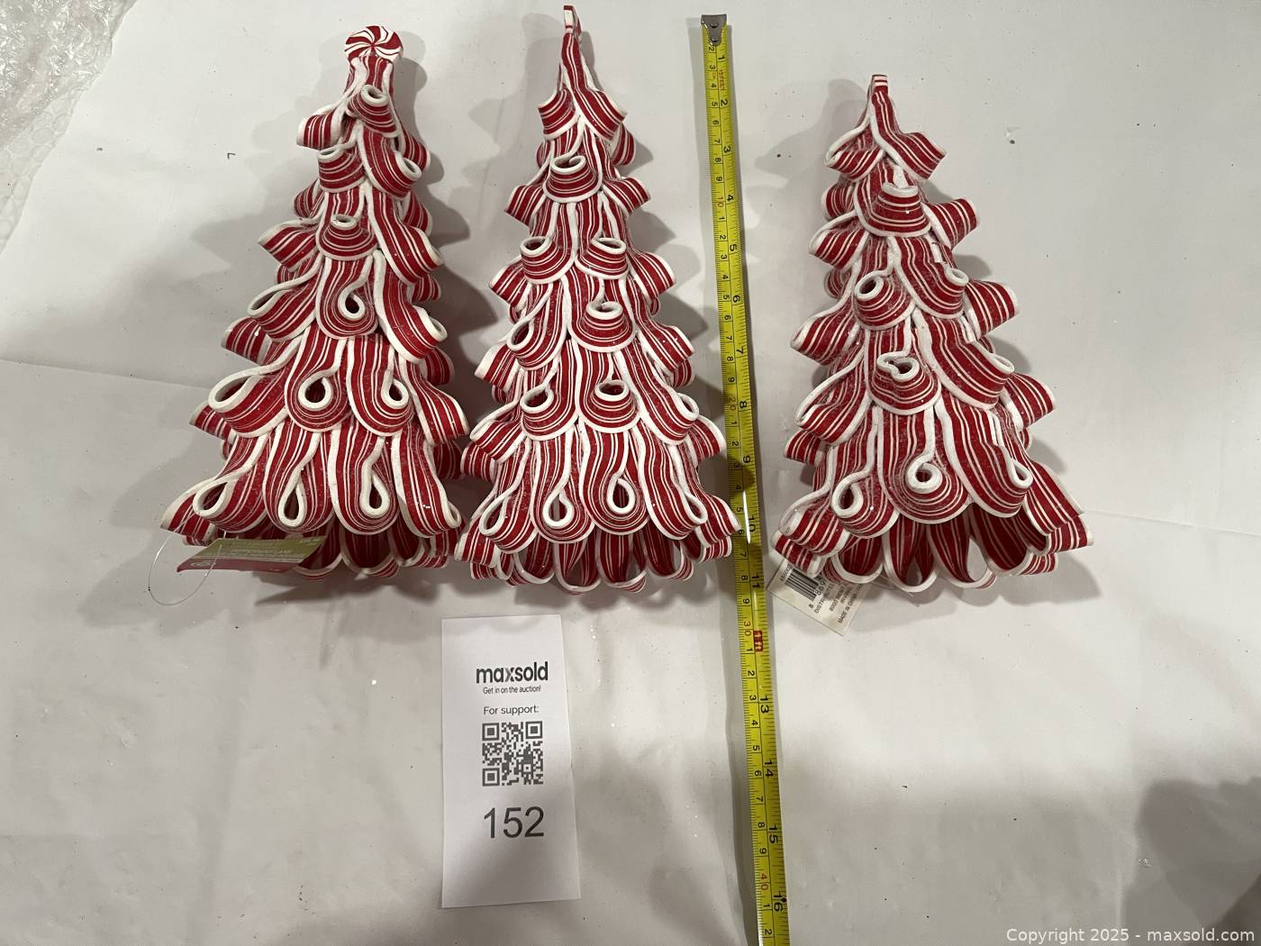 Three peppermint stripe resin Christmas trees | Maxsold
