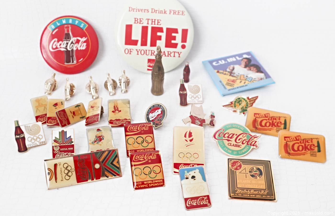 30 vintage Coca-Cola lapel pins | Maxsold
