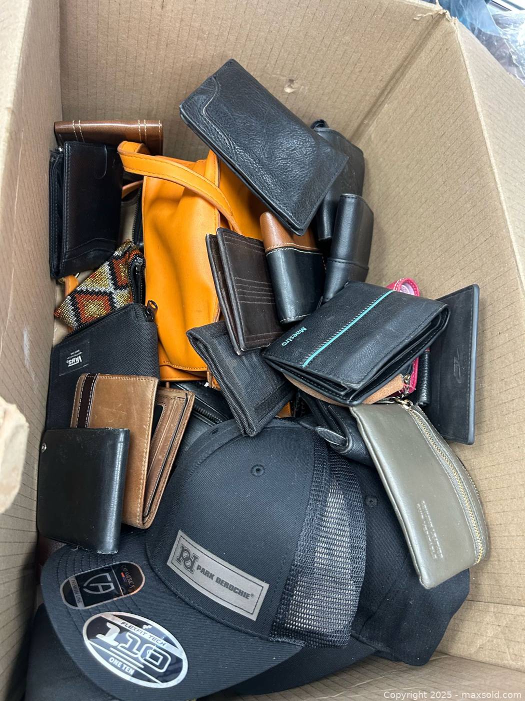 Box of assorted wallets and three new hats | Maxsold