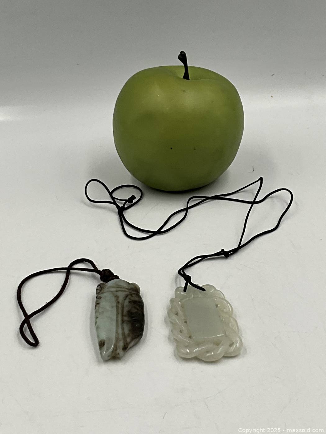 Two Hand-Carved Stone Pendants | Maxsold