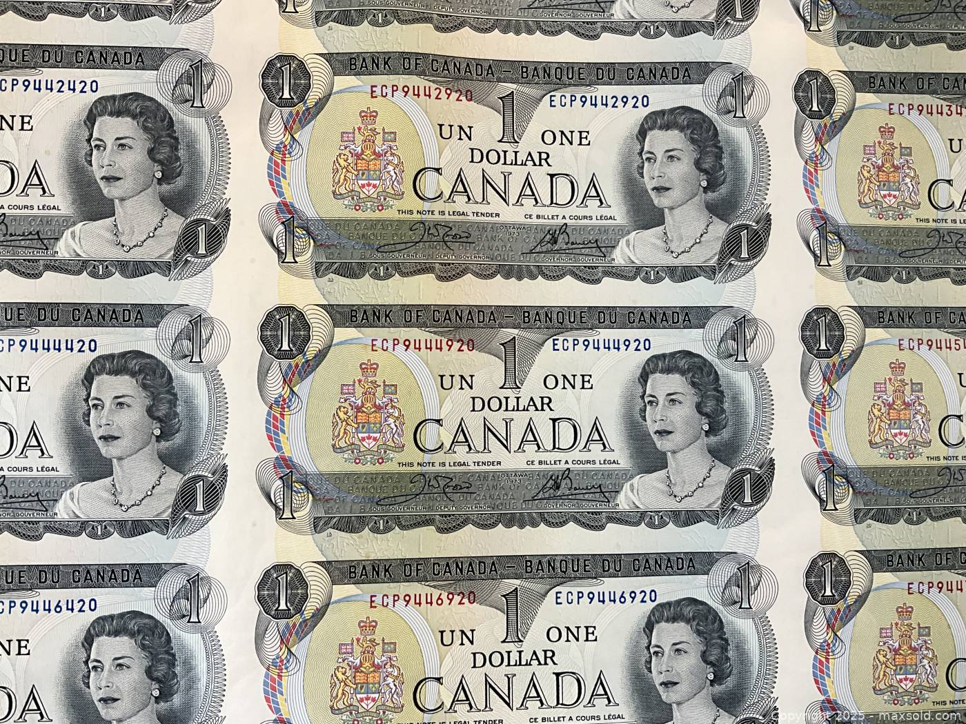 Framed uncut sheet of 1973 $1 Canadian banknotes | Maxsold