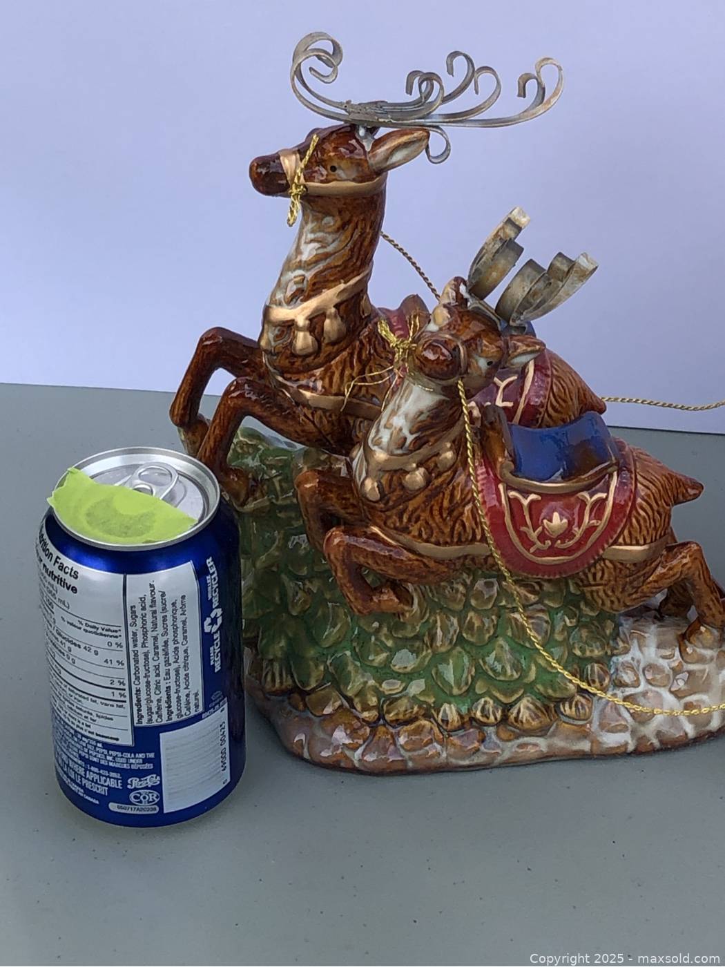 Ceramic Santa sleigh and reindeer figurines | Maxsold