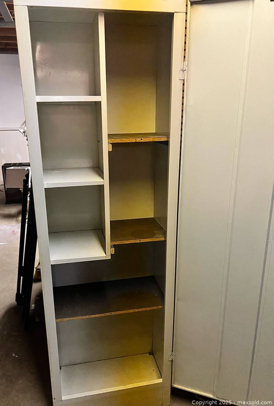 White metal storage cabinet | Maxsold