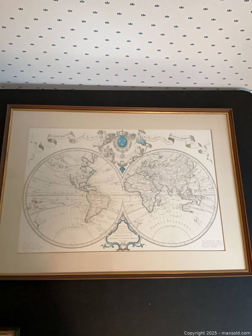 Framed double-hemisphere world map print with two cartographic wooden ...