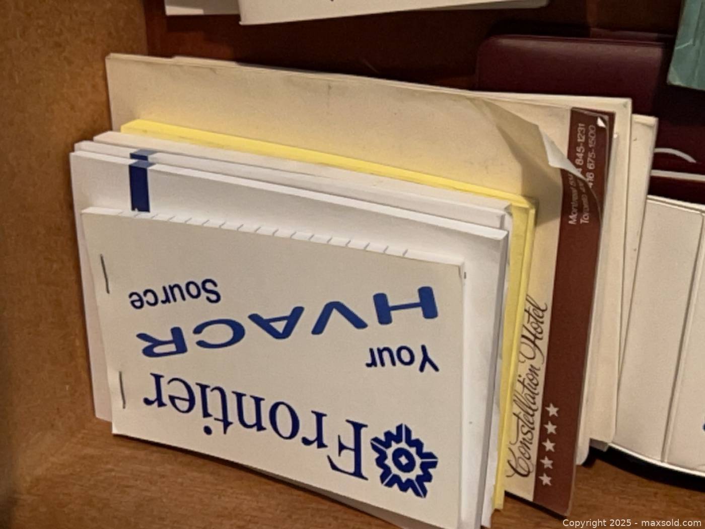 Assorted vintage pocket notebooks, envelopes, loose sheets, broken pencil sharpener | Maxsold