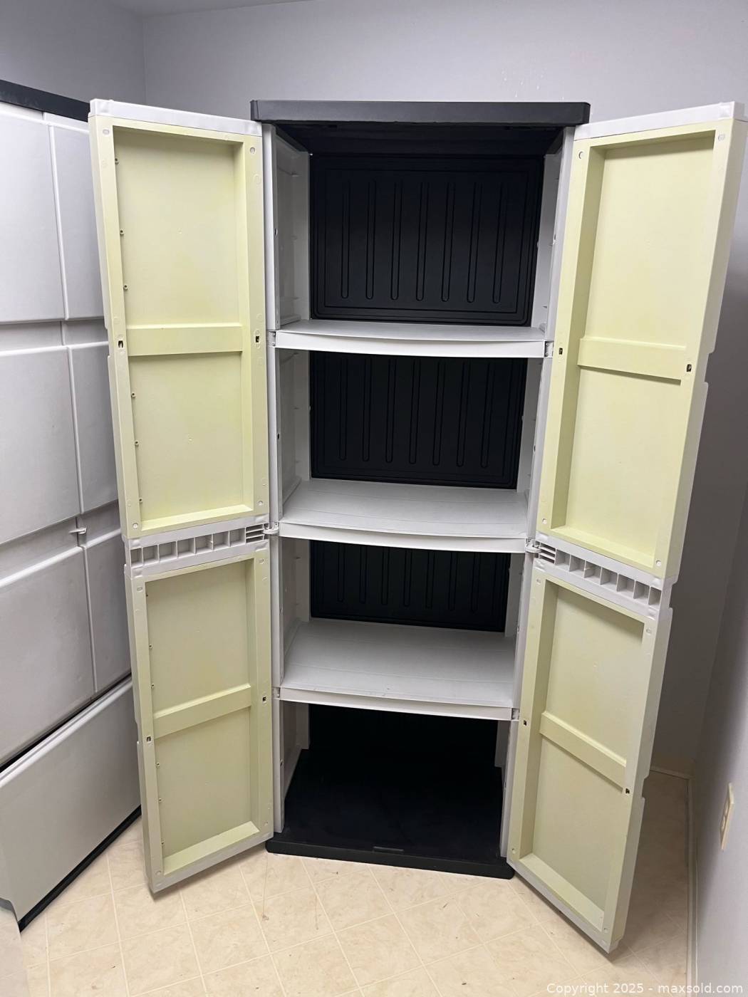 Two tall plastic storage cabinets | Maxsold