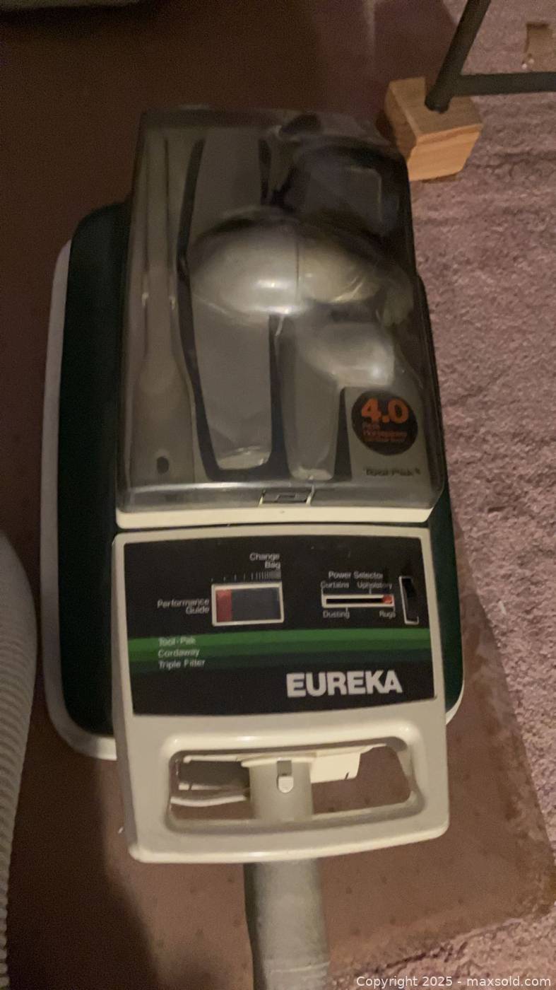 Eureka Power Pak Canister Vacuum & Ironing Board | Maxsold