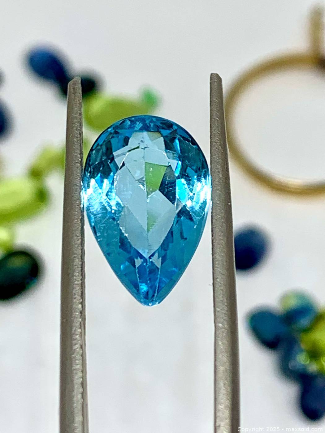 Natural pear-shape blue topaz gemstone 8.11 ct | Maxsold