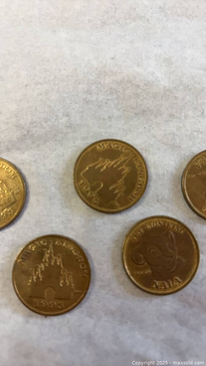 Five Disney Magic Kingdom souvenir coins, 1993-1995 | Maxsold