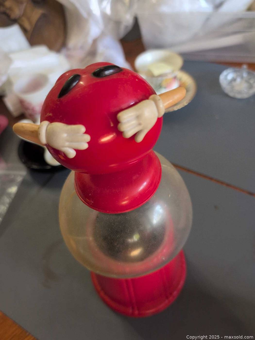 Red M&M's coin dispenser | Maxsold