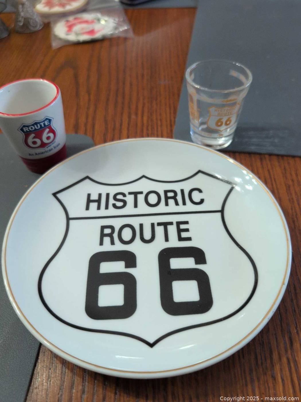 Route 66 plate and two shot glasses | Maxsold